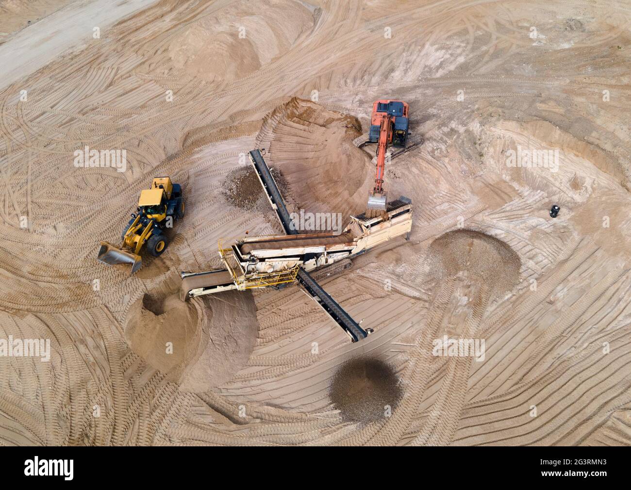 Arial view of the sand open-pit mining with heavy mining machinery ...
