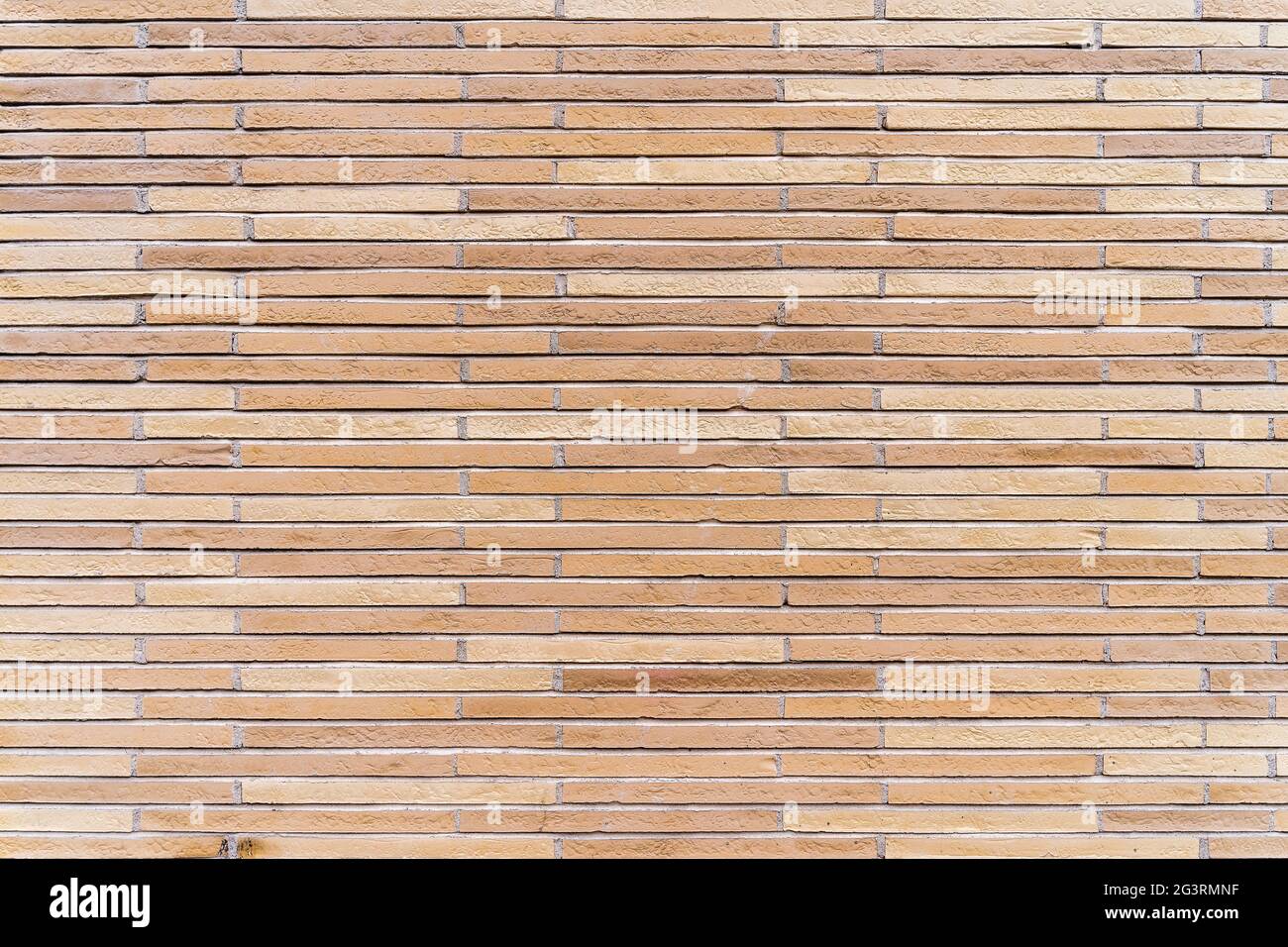 New, rustic brown and beige brick or tile wall Stock Photo - Alamy