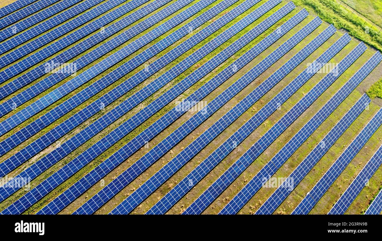 Aerial drone view flight over solar power station panels Stock Photo ...