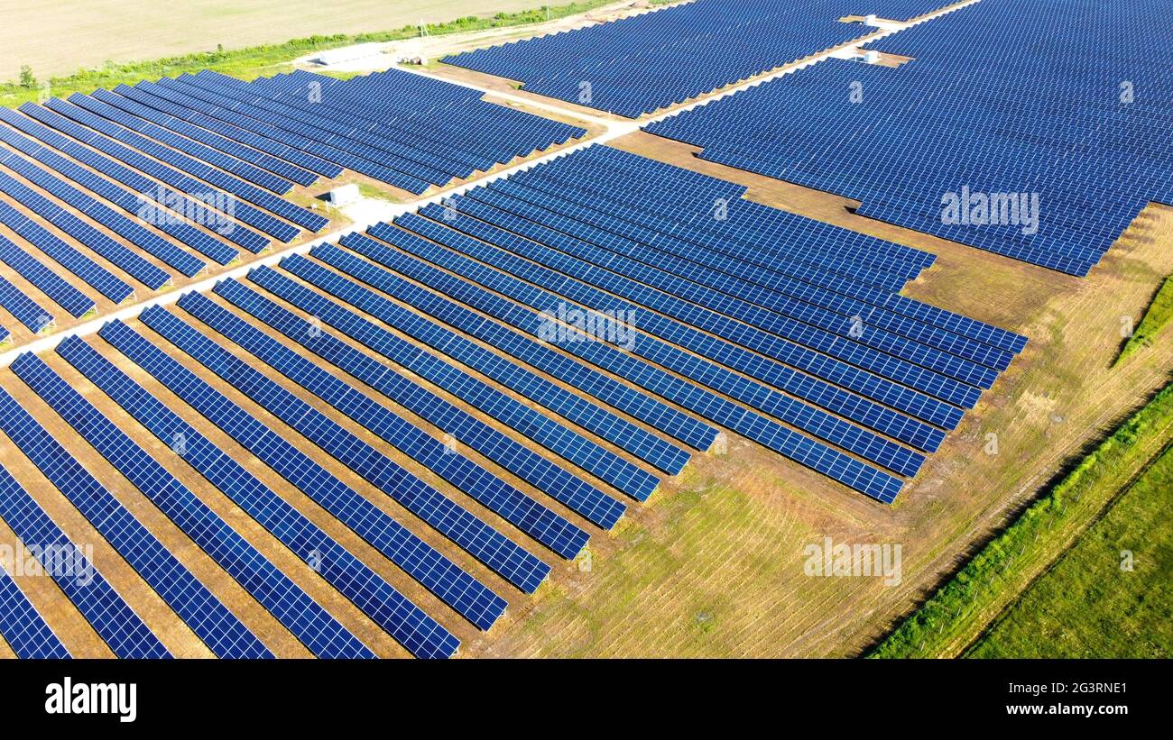 Aerial drone view flight over solar power station panels Stock Photo ...