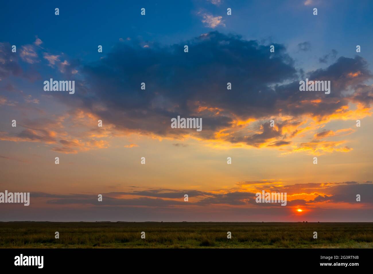Clouds at sunset over prairie landscape hi-res stock photography and ...