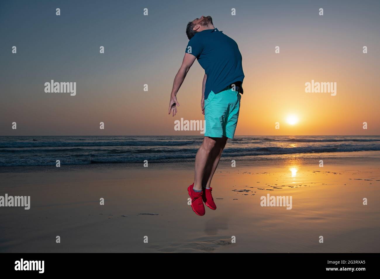 Man jumping on nature, silhouette in the sunset. Amazing view on sunset ...