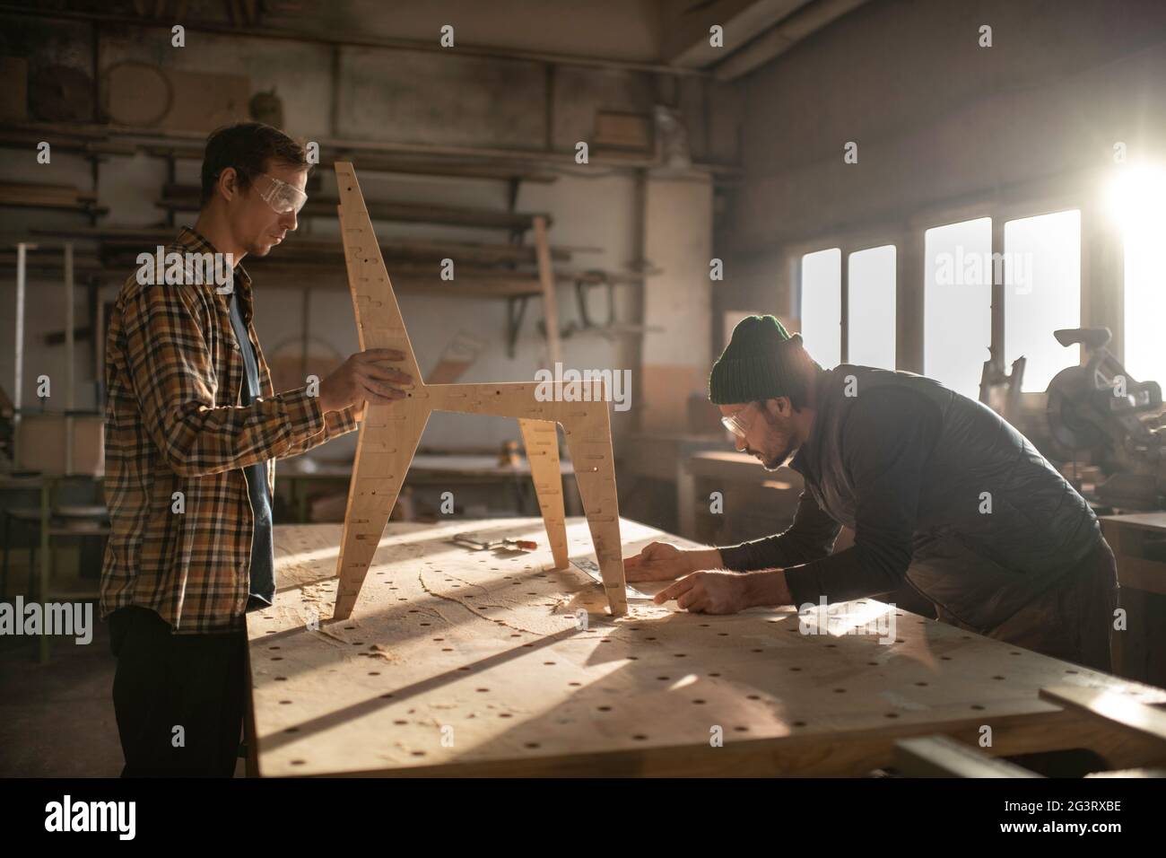 Craftsmen making chair in joinery Stock Photo - Alamy