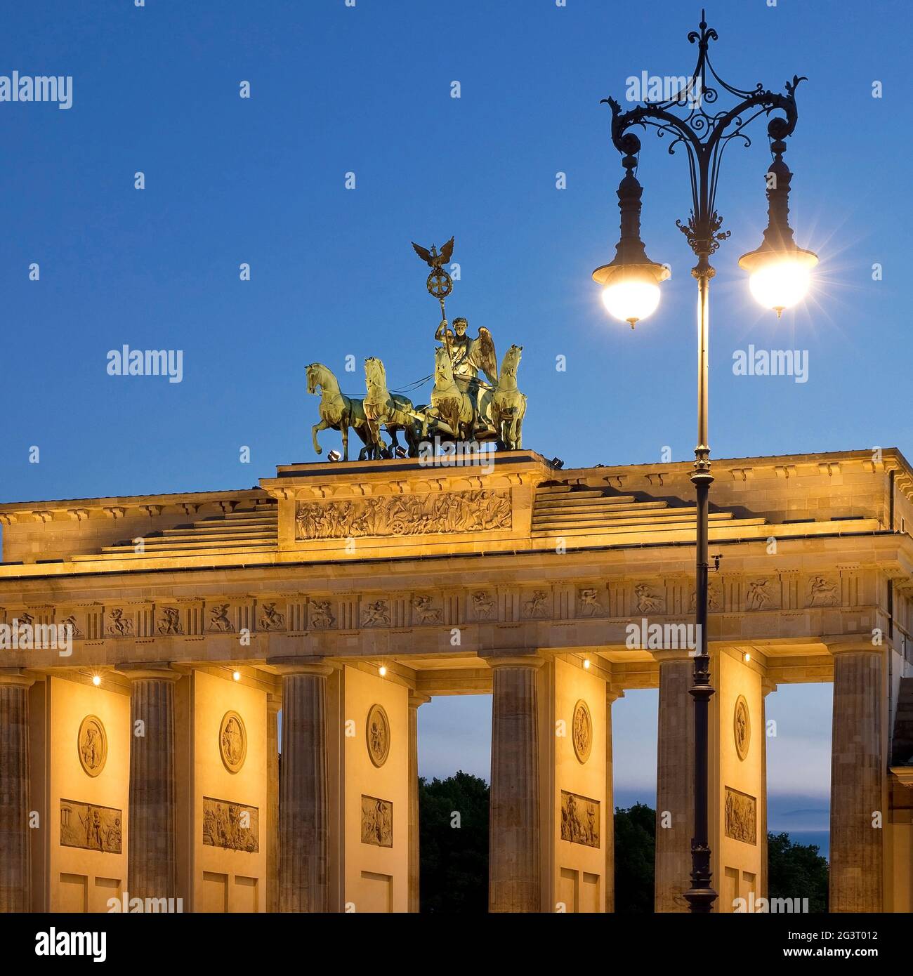 Quadriga on the Brandenburger Tor with historic gas lantern on the ...