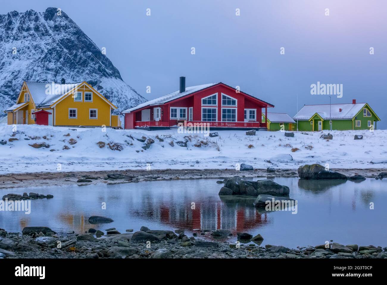 Low Tide in the Fjord and Norwegian Cottages in the Winter Evening ...