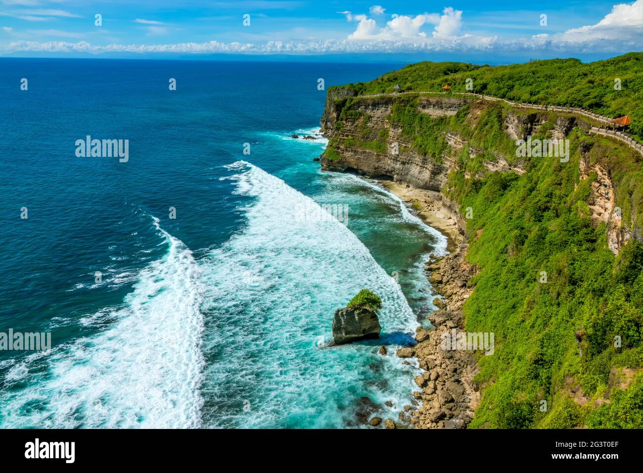 Rocky Tropical Shore and Promenade with Arbours Stock Photo - Alamy