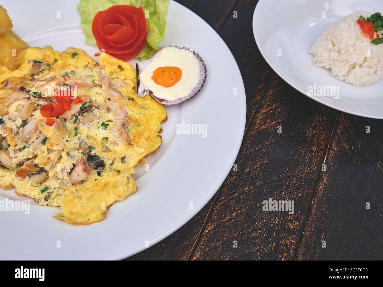 Peruvian food, "tortilla de mariscos" seafood omelette, Selective focus ...
