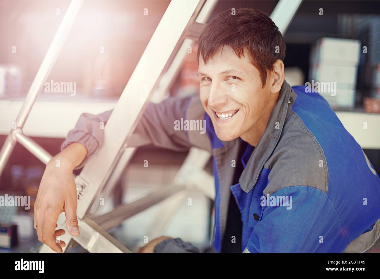 A cheerful and happy employee smiles at the workplace Stock Photo - Alamy