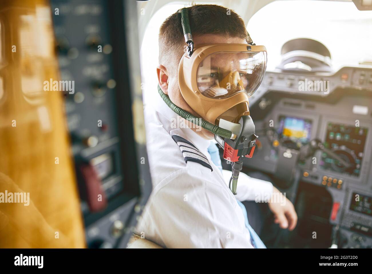 Male pilot wear air mask in cockpit of airplane Stock Photo - Alamy