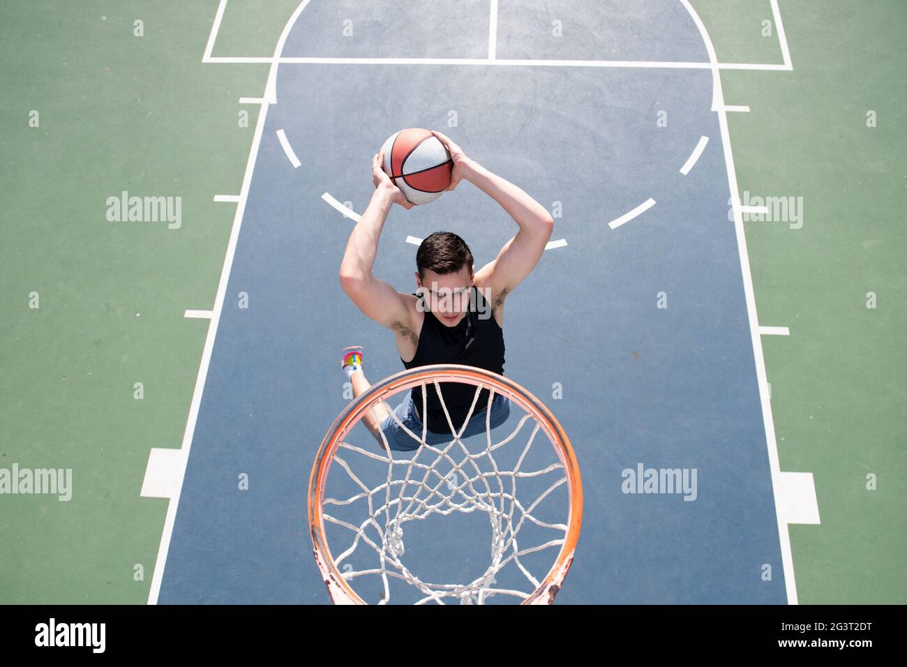 Basketball player. Sports and basketball. Man jumps and throws a ball ...