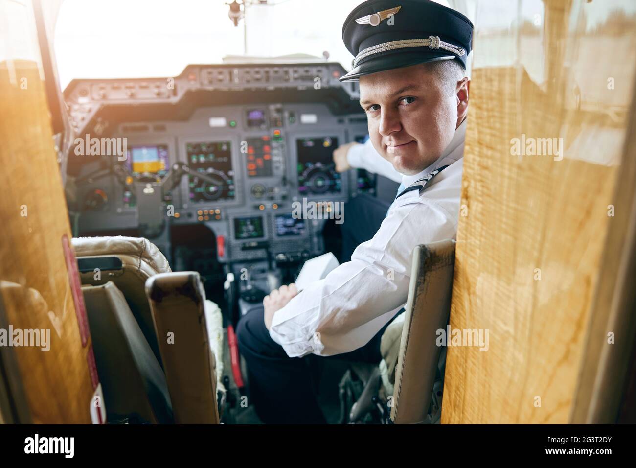 Male pilot in cockpit of passenger airplane jet Stock Photo - Alamy