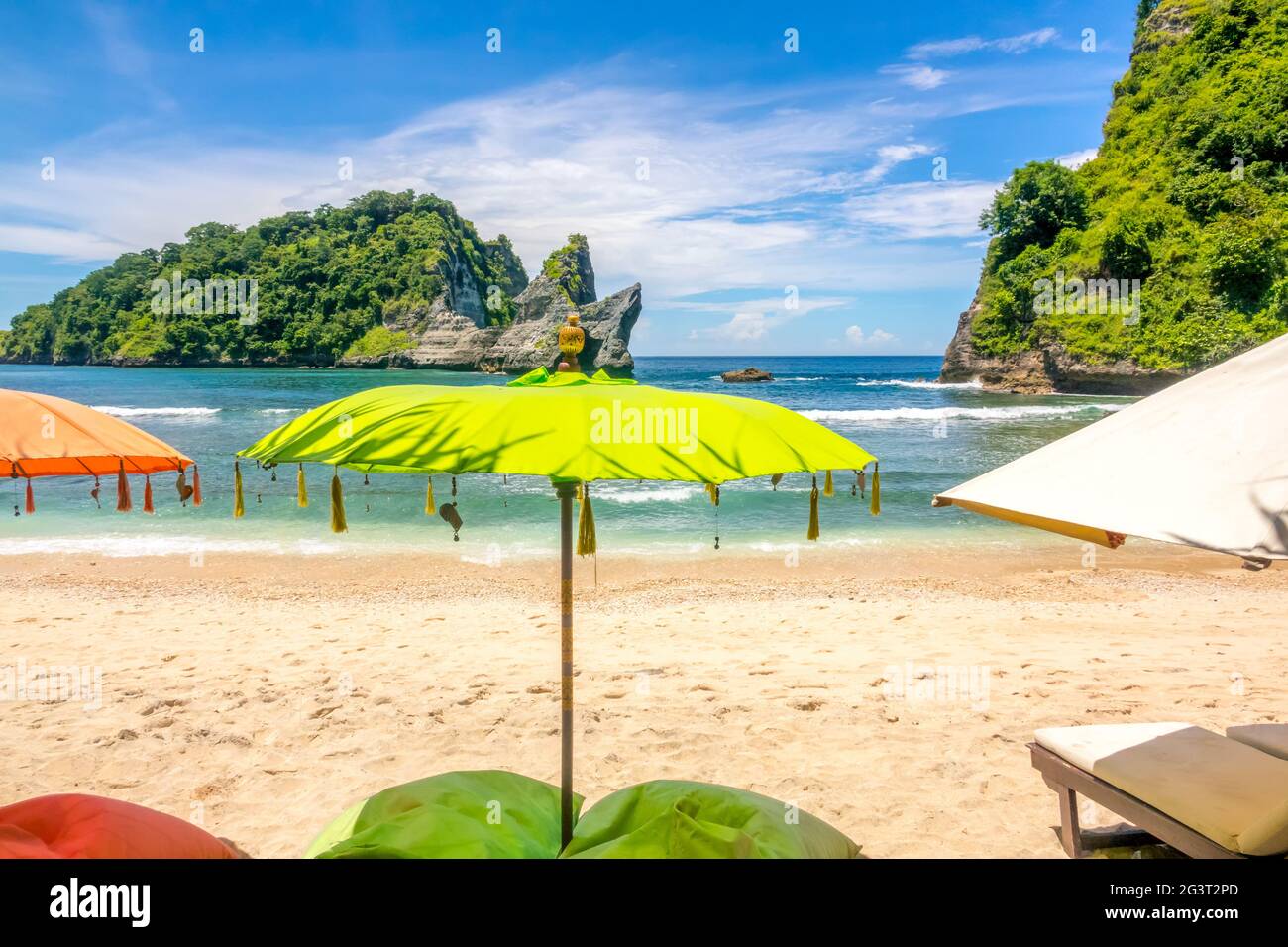 Umbrellas and Sunbeds on a Tropical Beach Stock Photo - Alamy