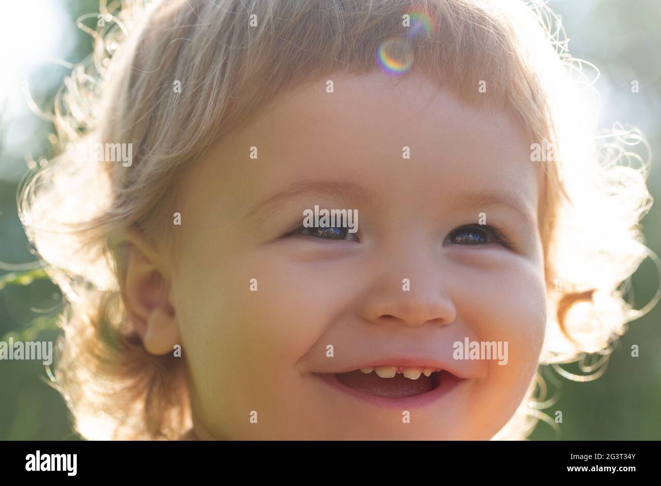 Portrait of a happy laughing child. Close up positive kids cropped face ...