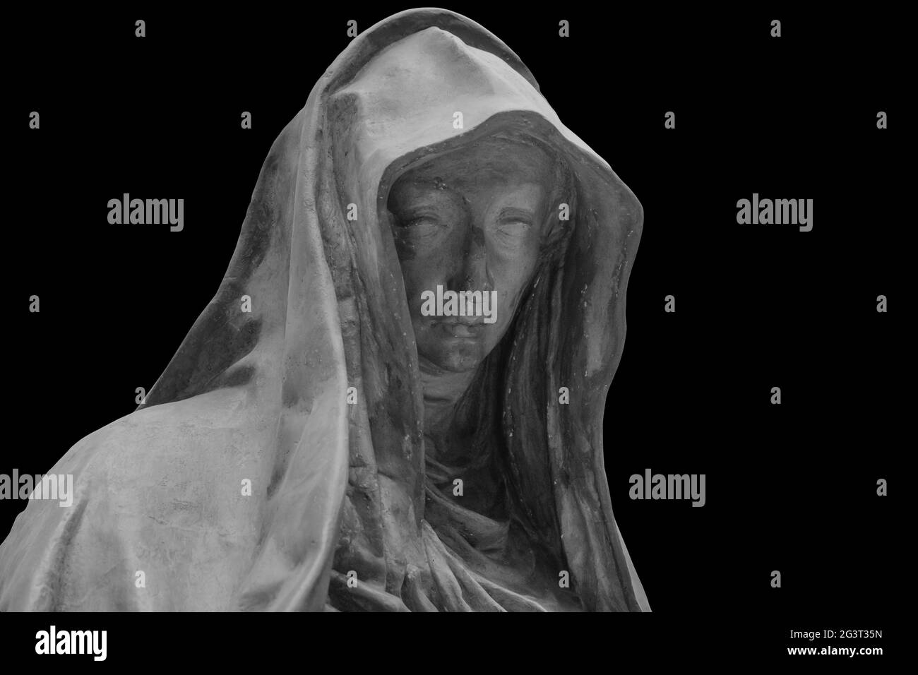 Face of statue of grieving woman isolated on black background. Plaster ...