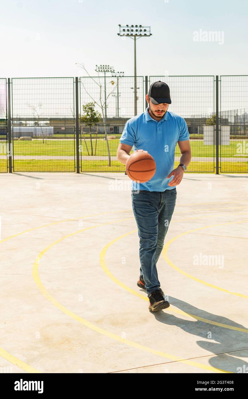 Front view of male playing basketball outdoor, public sports park Stock ...