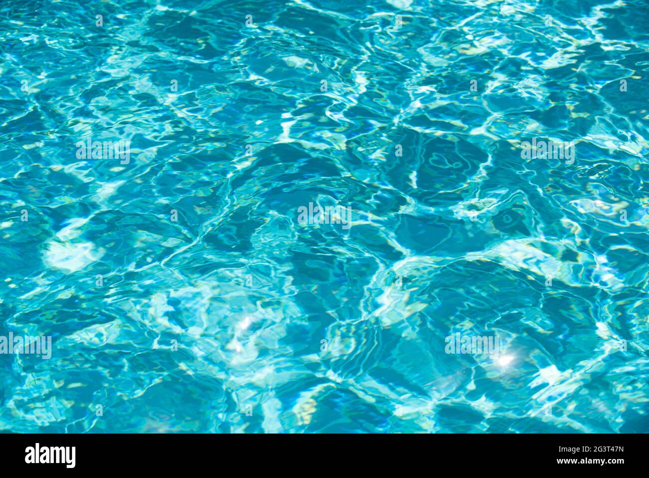 Abstract ripple wave and clear turquoise water surface in swimming pool ...