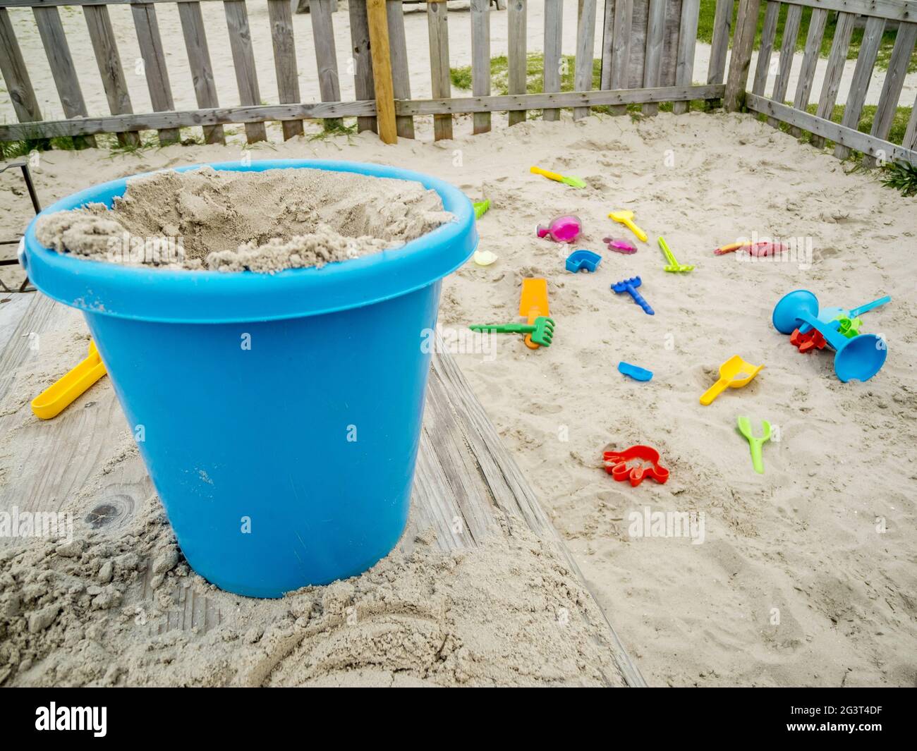Blue digging bucket in the digging box Stock Photo - Alamy