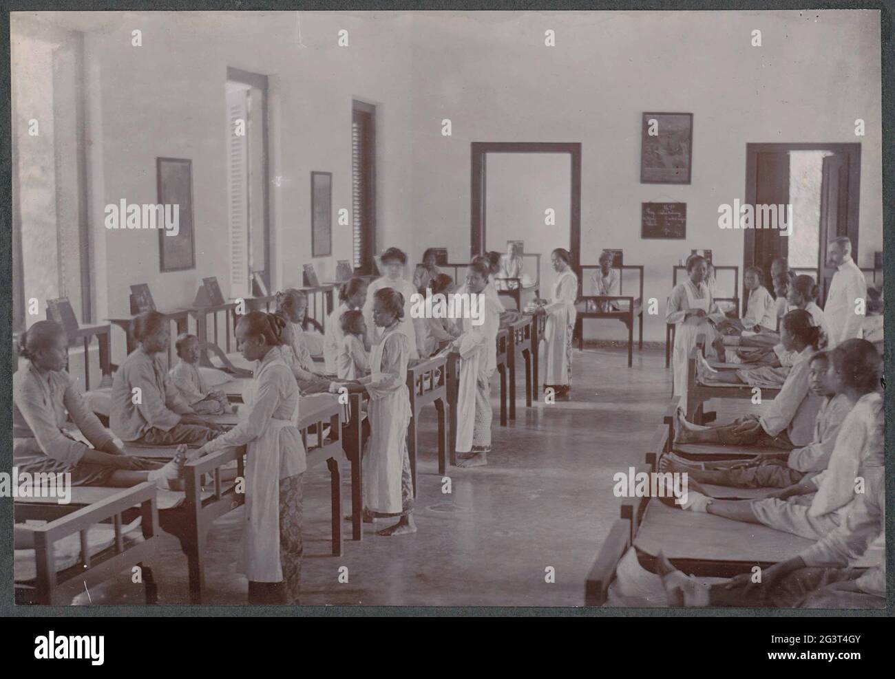Hospital with female patients and staff in a hospital in the Dutch East ...