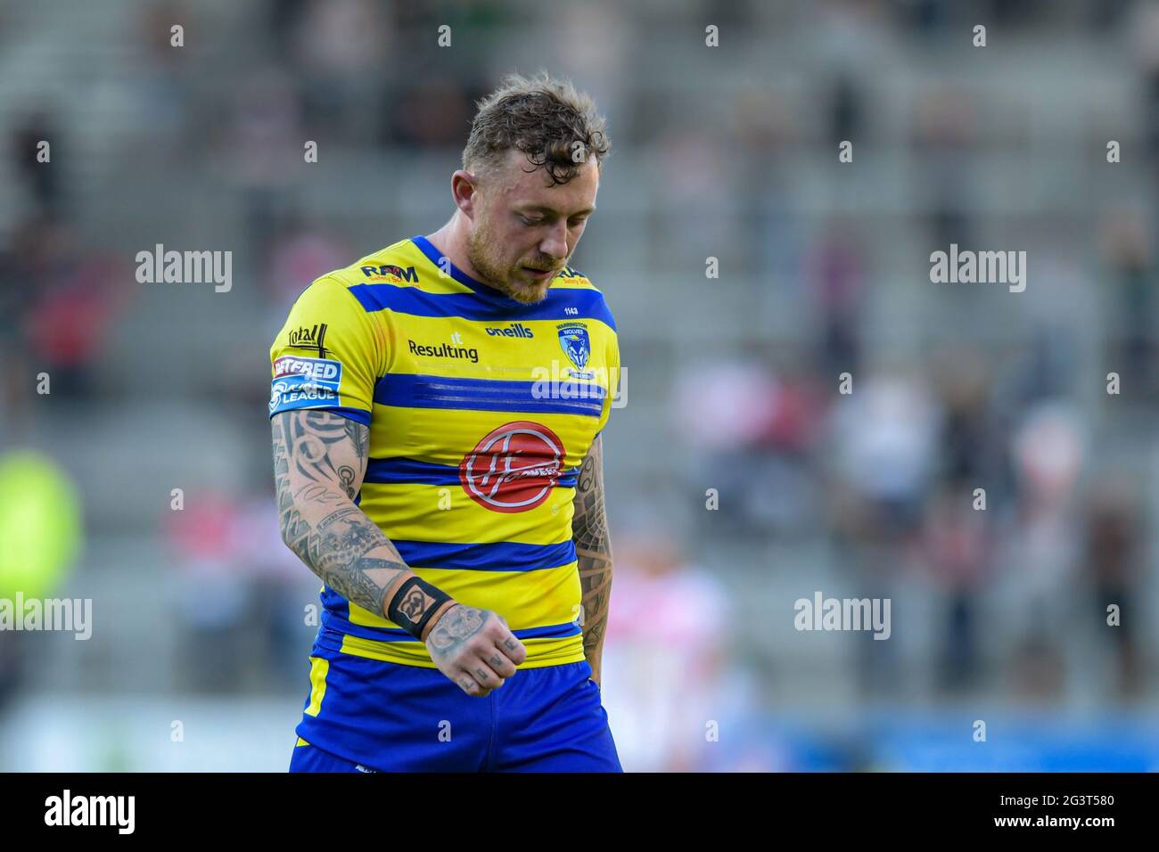 Josh Charnley (5) of Warrington Wolves looks down at the ground Stock ...