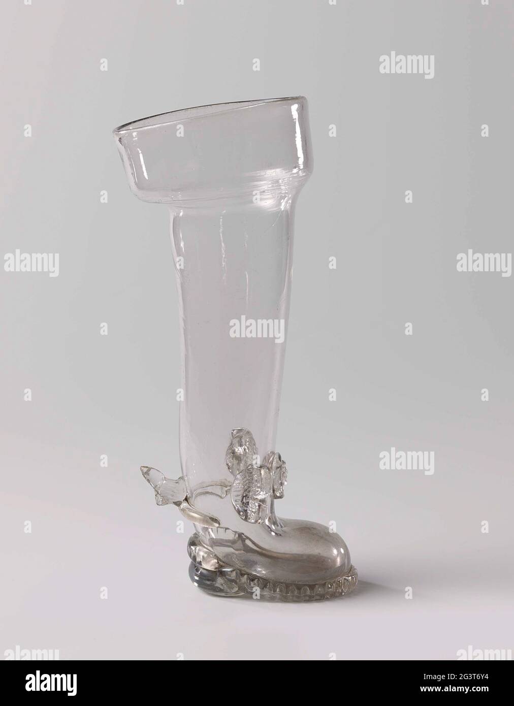 Glass in the shape of a riding boot. Sole deposited with a ribbed wire ...