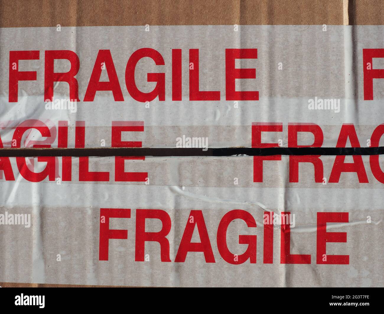 Fragile on cardboard packet Stock Photo - Alamy