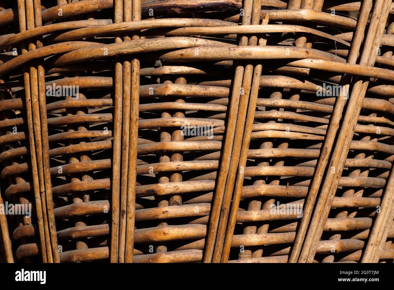 Texture of a wicker basket close-up. Abstract background with a wood ...