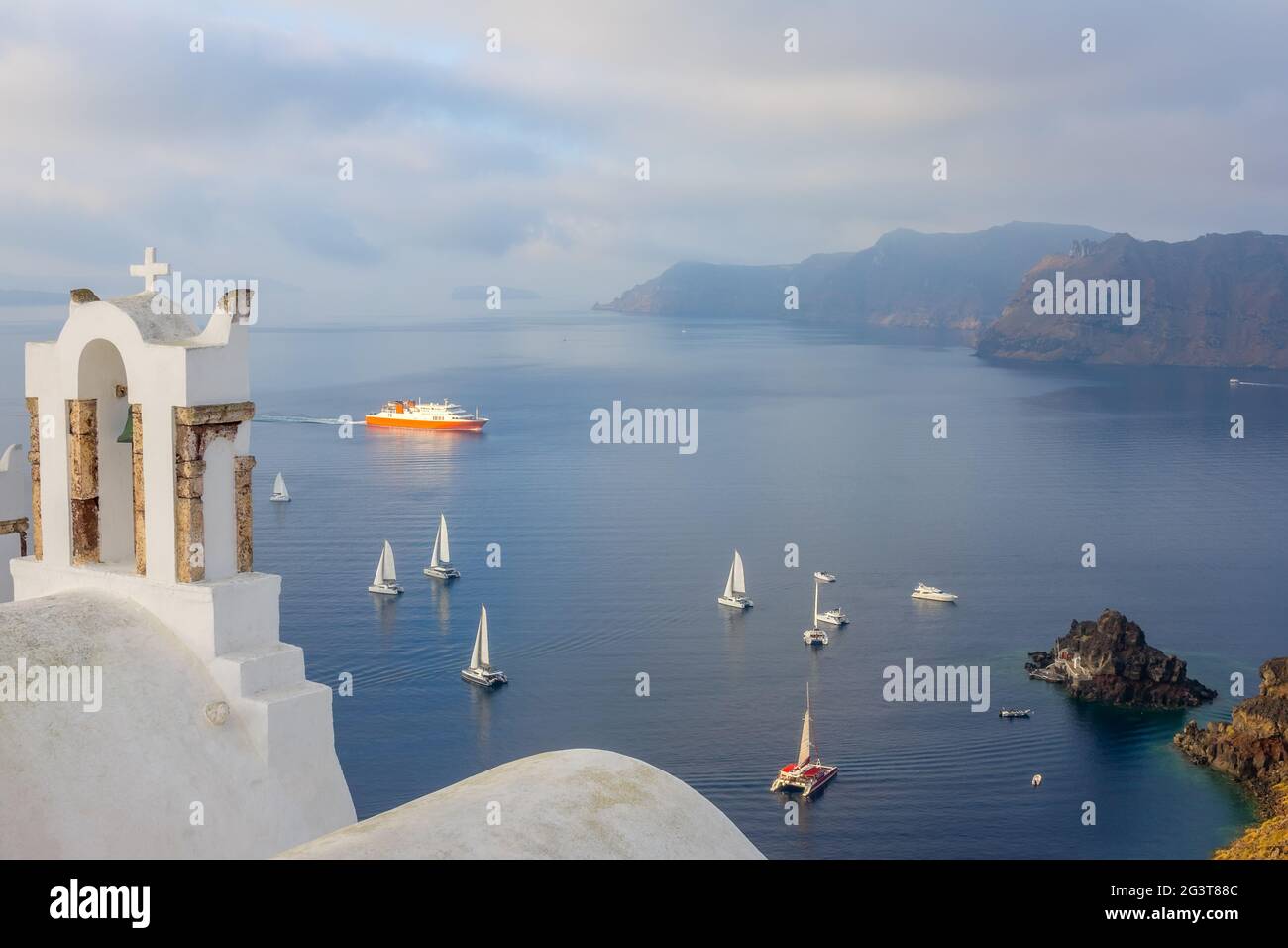 Cross of the Greek Church and Caldera With Sailing Yachts and a Cruise ...