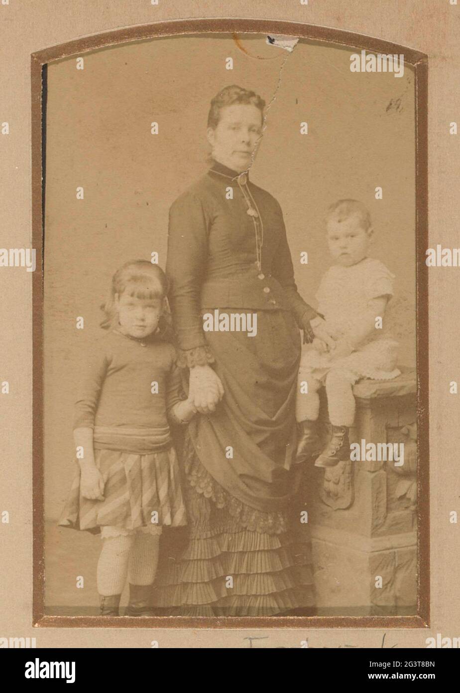Portrait of a woman with two children. Part of album with 28 photos of ...
