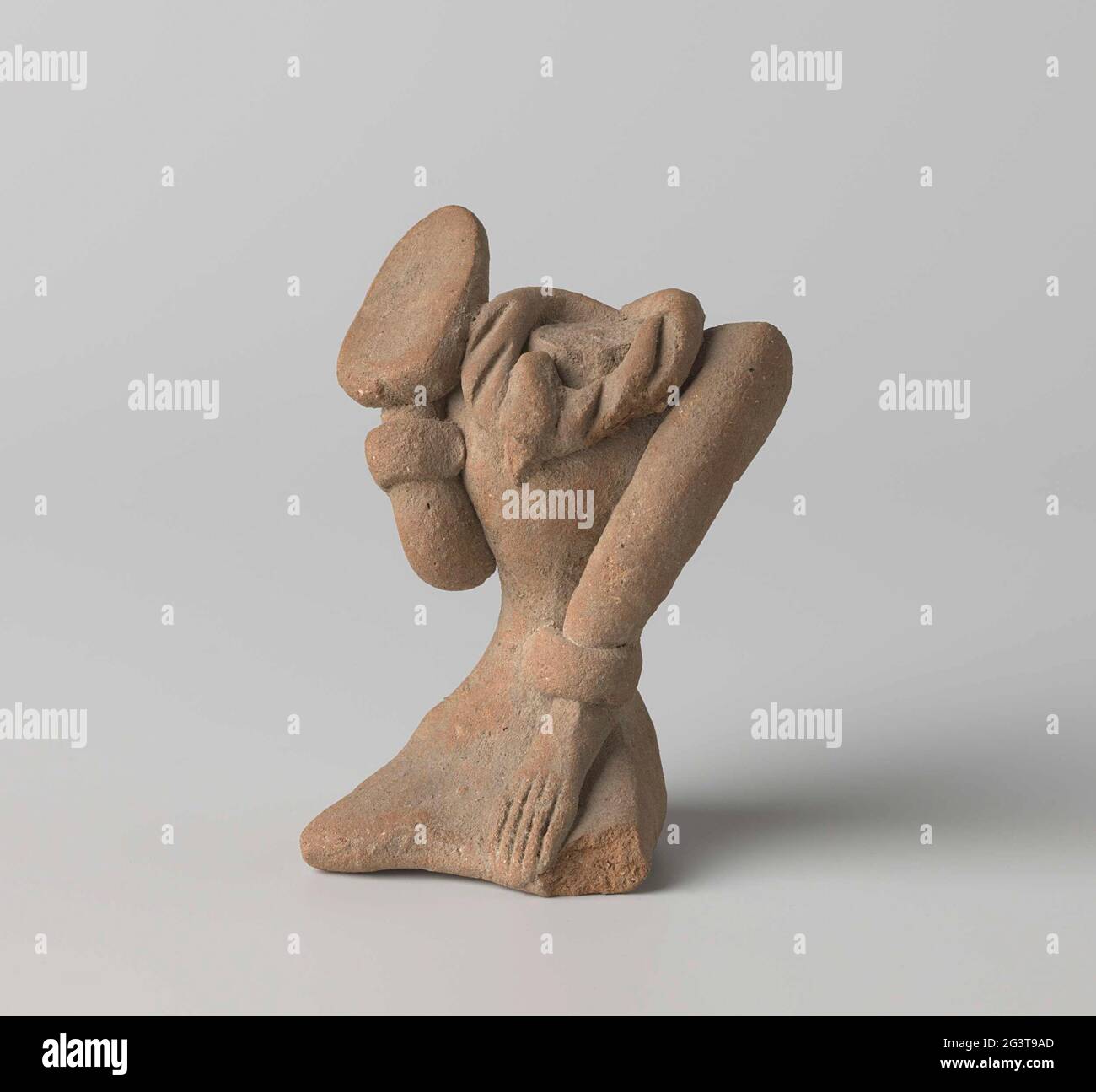 Sculpture. Figure, sitting or hacking, without head. Bracelets around ...