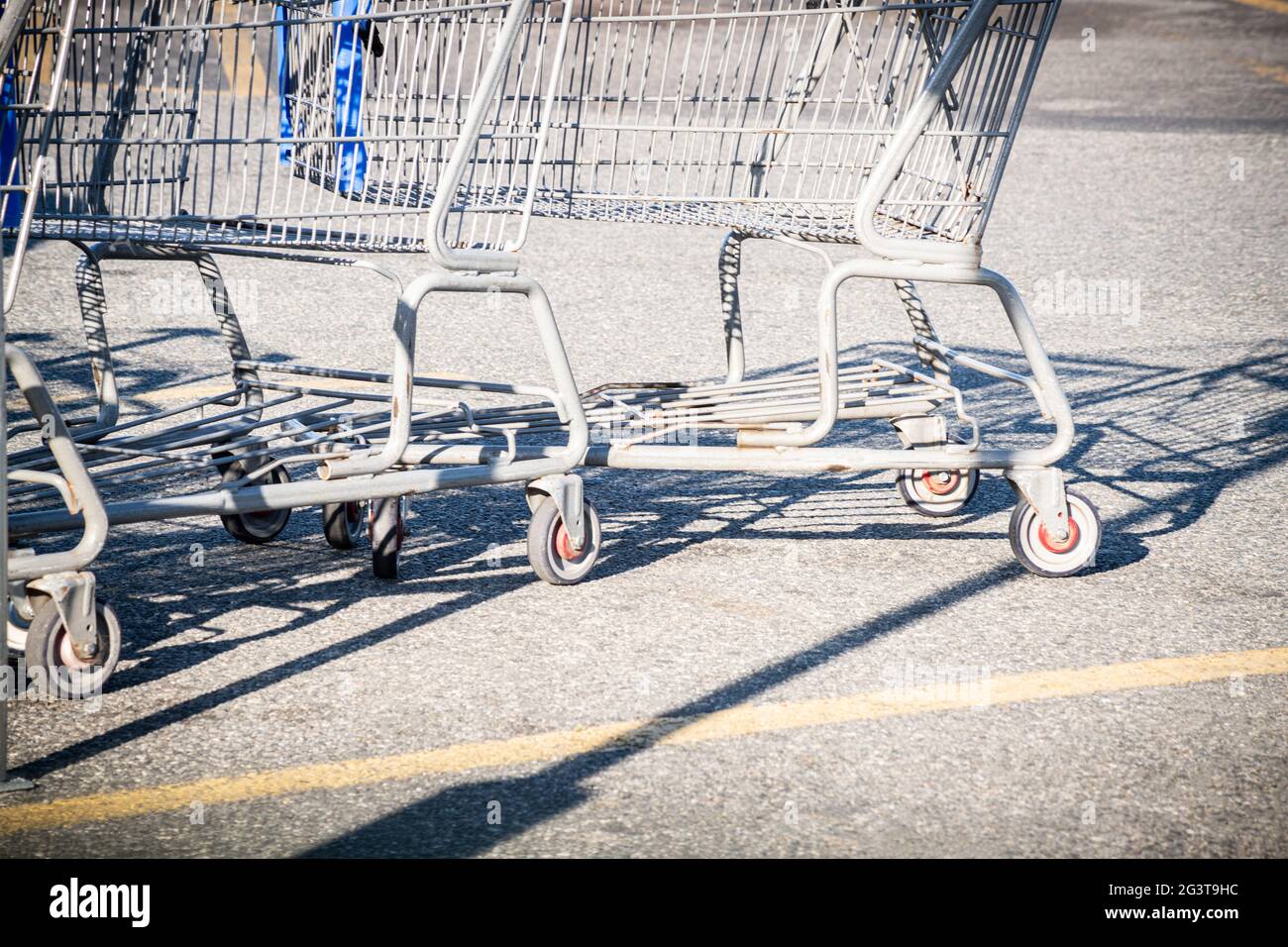 A close-up shot of a shopping cart at the parking lot of a grocery ...
