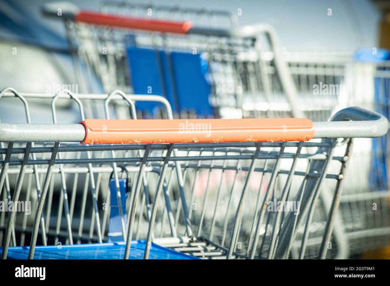 A close-up shot of a shopping cart at the parking lot of a grocery ...