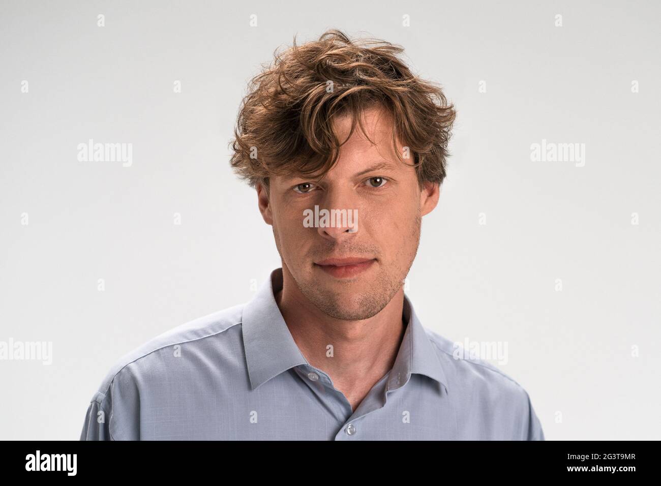 Nice-looking attractive guy isolated on light white pastel background ...