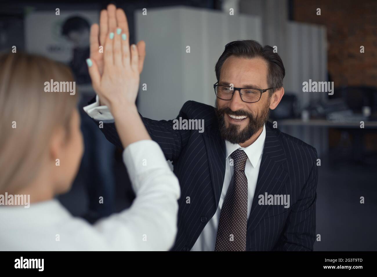 Happy Successful Businessman giving high five with businesswoman ...