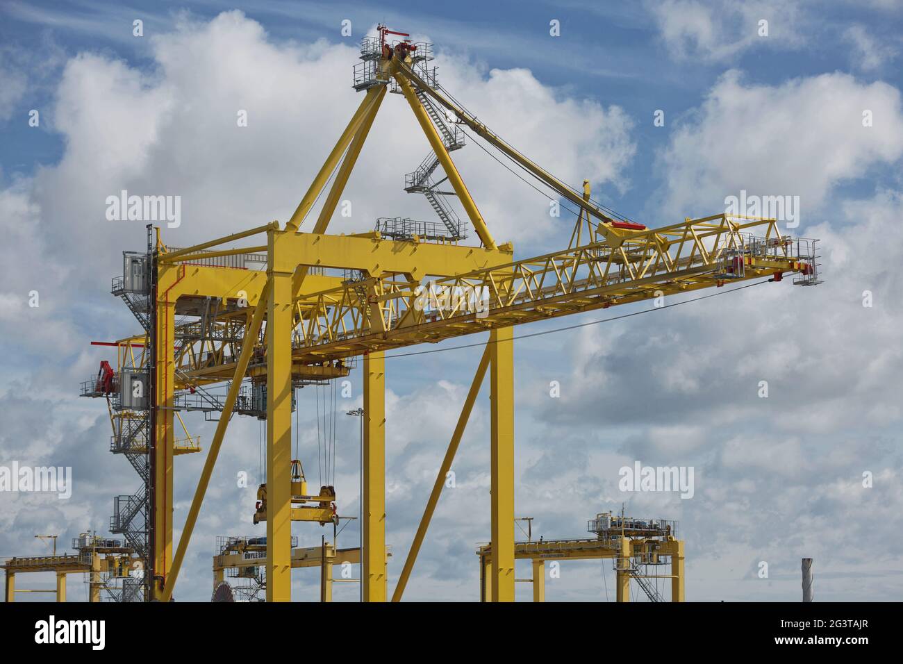 Large industrial cranes loading container ship in Dublin Port in Ireland Stock Photo - Alamy