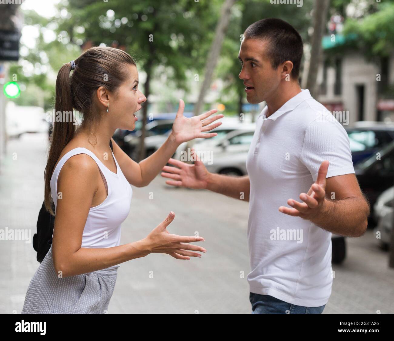 Angry man and woman quarreling Stock Photo - Alamy