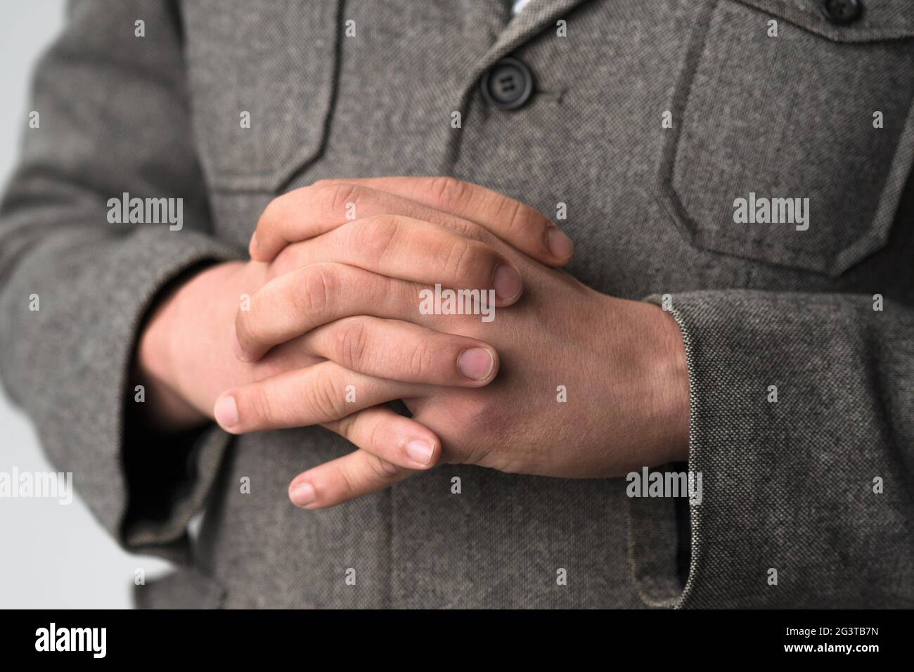 Young man putting on jacket hi-res stock photography and images - Alamy