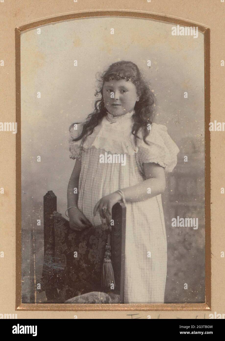 Portrait of a girl at an armchair. Part of album with 28 photos of a ...