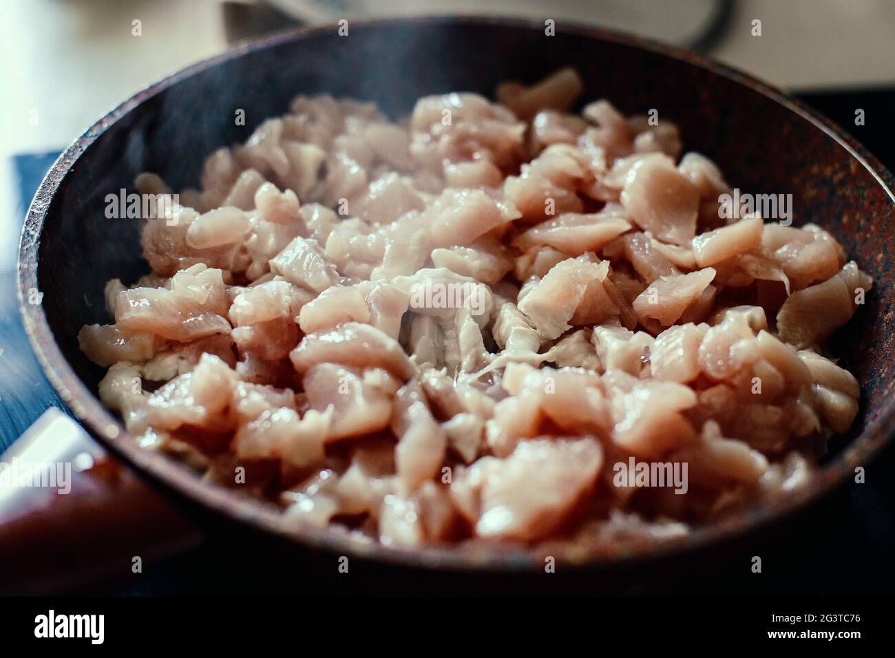 Pieces of sliced meat are stewed in a frying pan. Roasting meat on an ...