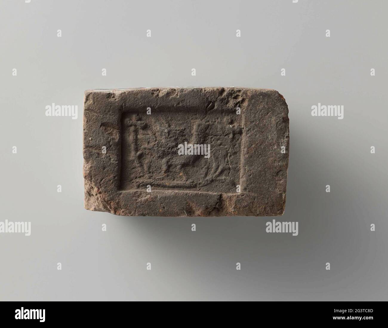 Fair stone, on which a bird on a branch and two clover leaves in the ...