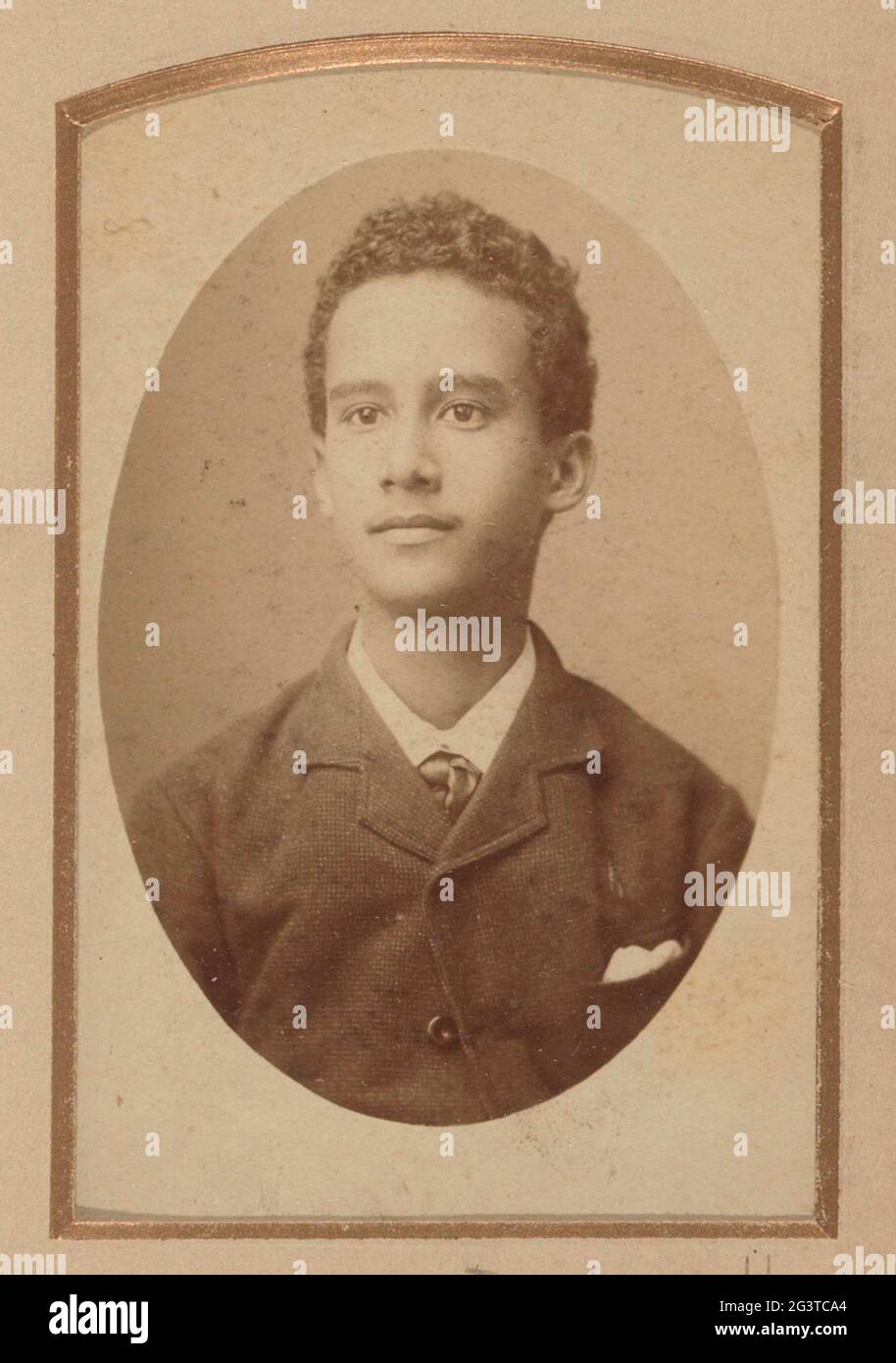 Portrait of (presumably) a Surinamese boy. Part of album with 28 photos ...