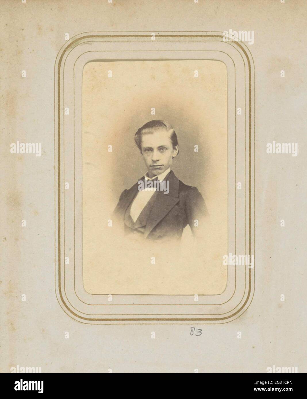 Portrait of a young man with a jacket and a bow. Part of family album ...