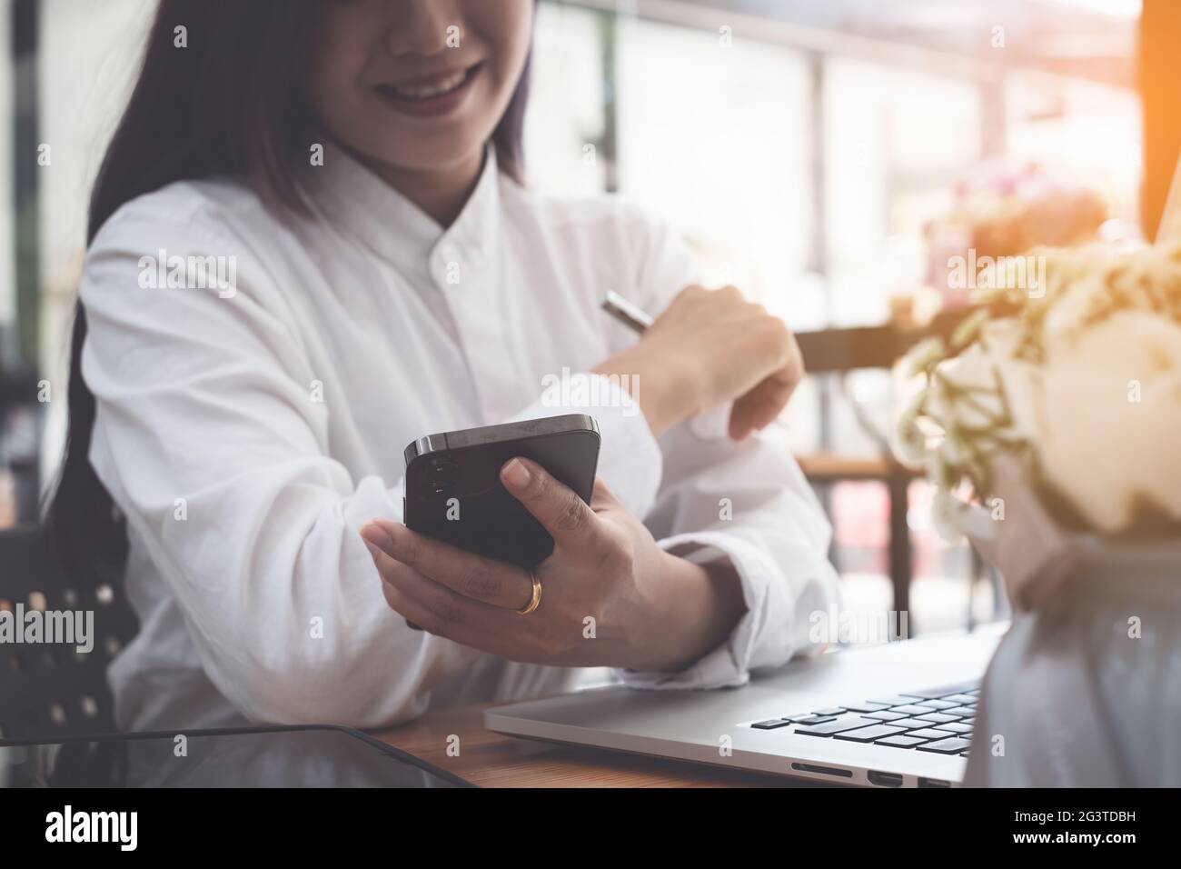 A businesswoman completes KYC using an online banking program in order ...