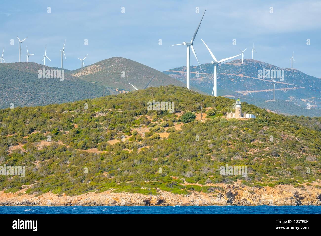 Wind Farms and Lighthouse on a Hilly Shore Stock Photo - Alamy