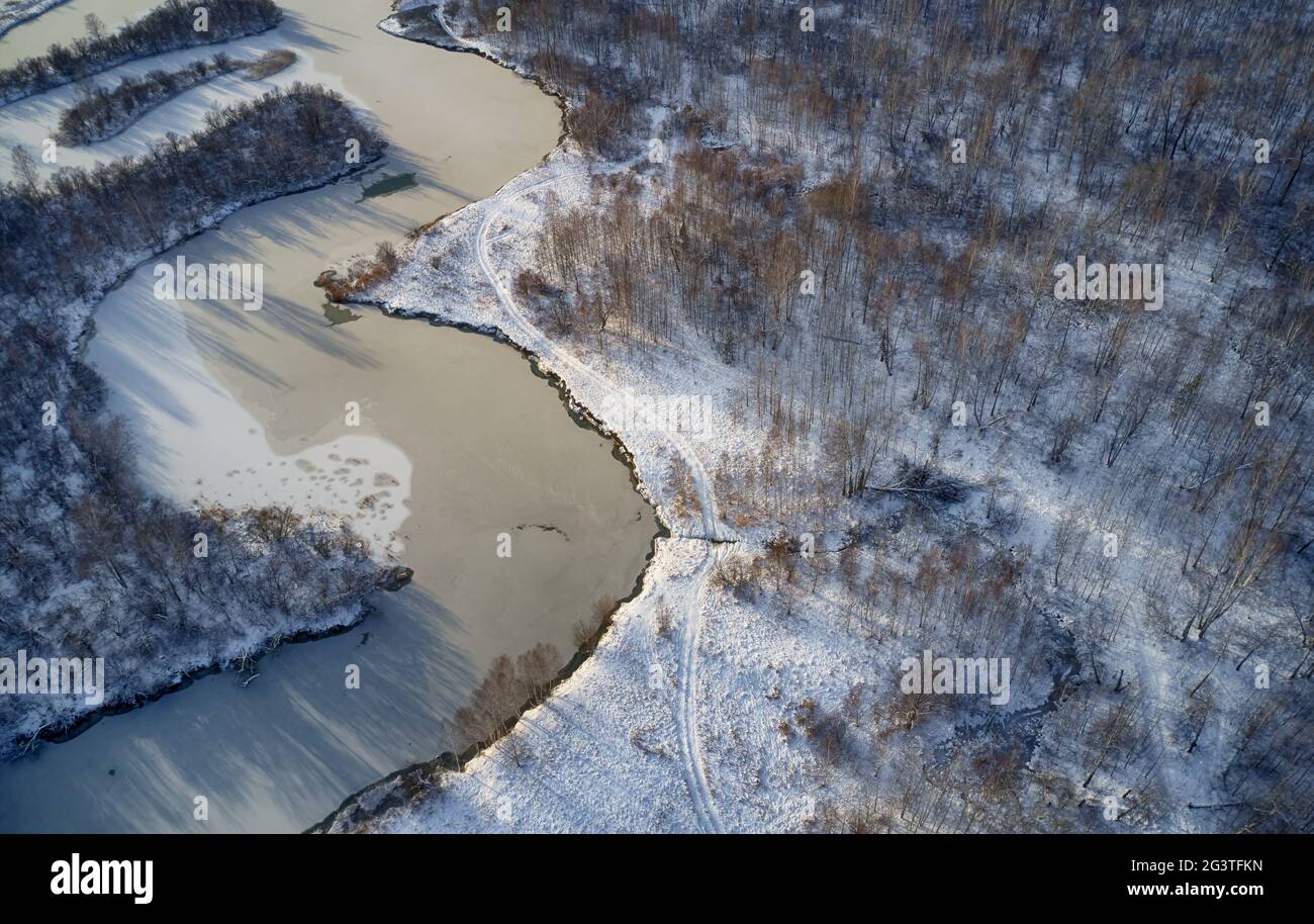 Aerial photo of Koen river under ice and snow. Beautiful winter ...