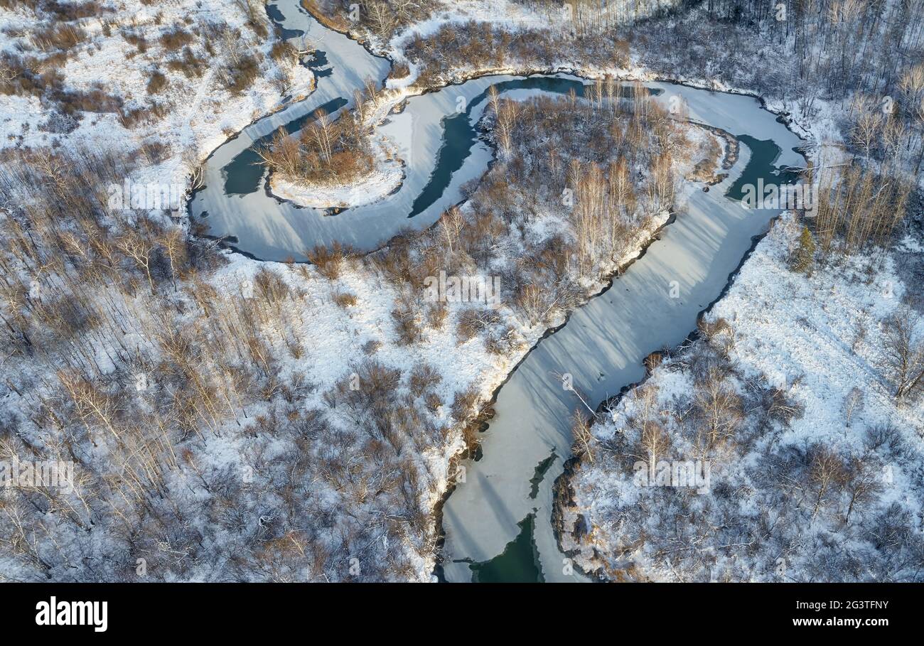 Aerial photo of Koen river under ice and snow. Beautiful winter ...
