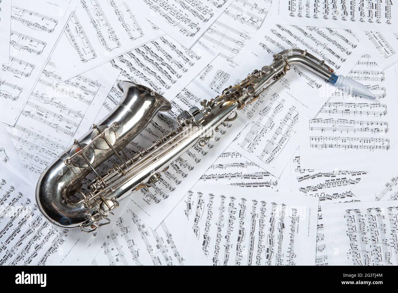 Saxophone And Notes Stock Photo - Alamy