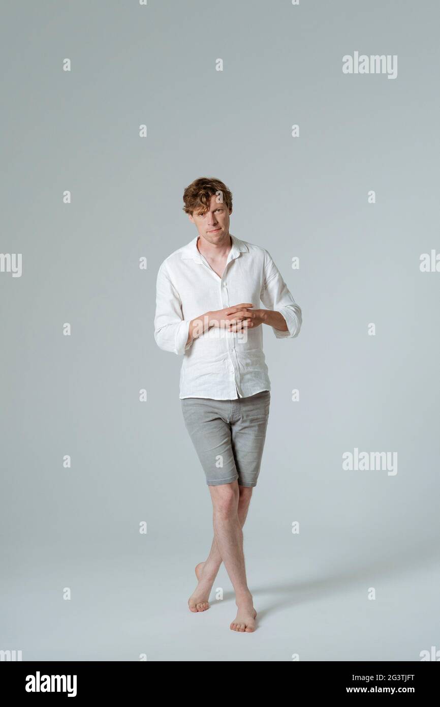 Legs crossed standing hi-res stock photography and images - Alamy