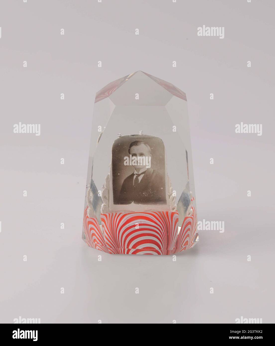 Paperweight with a portrait of a man Stock Photo - Alamy