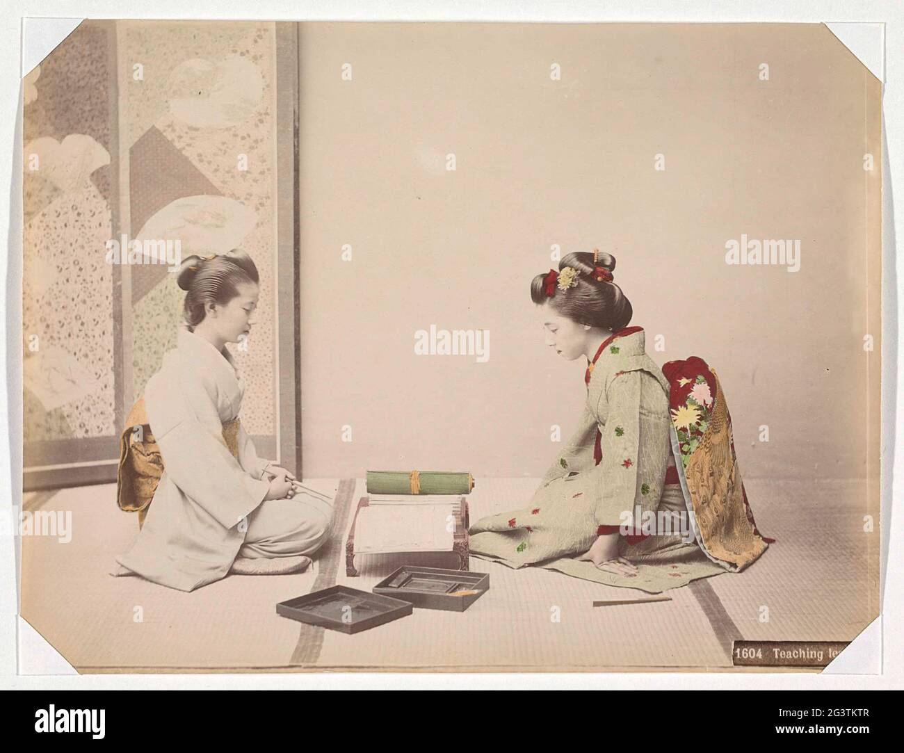 Two Japanese women during a lesson; Teaching Lesson. Part of album with ...