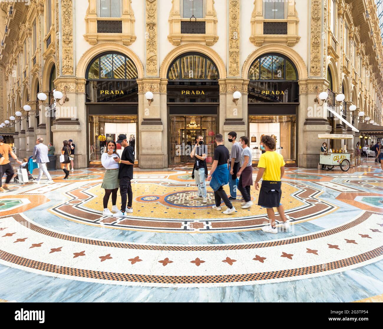 Fashion shopping in Milan, Italy. People walking in front of a famous ...